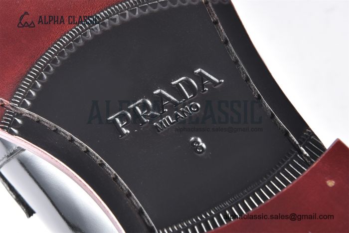 Prada Classic Black Calfskin Boot with the Iconic Enameled Metal ...